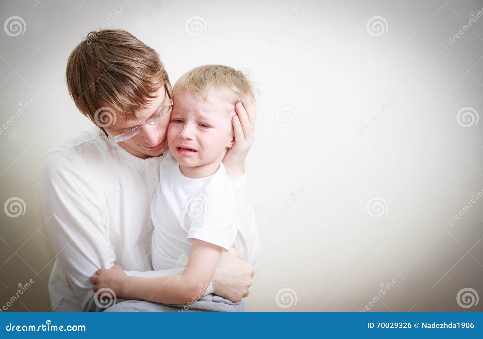 Father Comforting Her Crying Little Son Stock Photo - Image of hugging ...