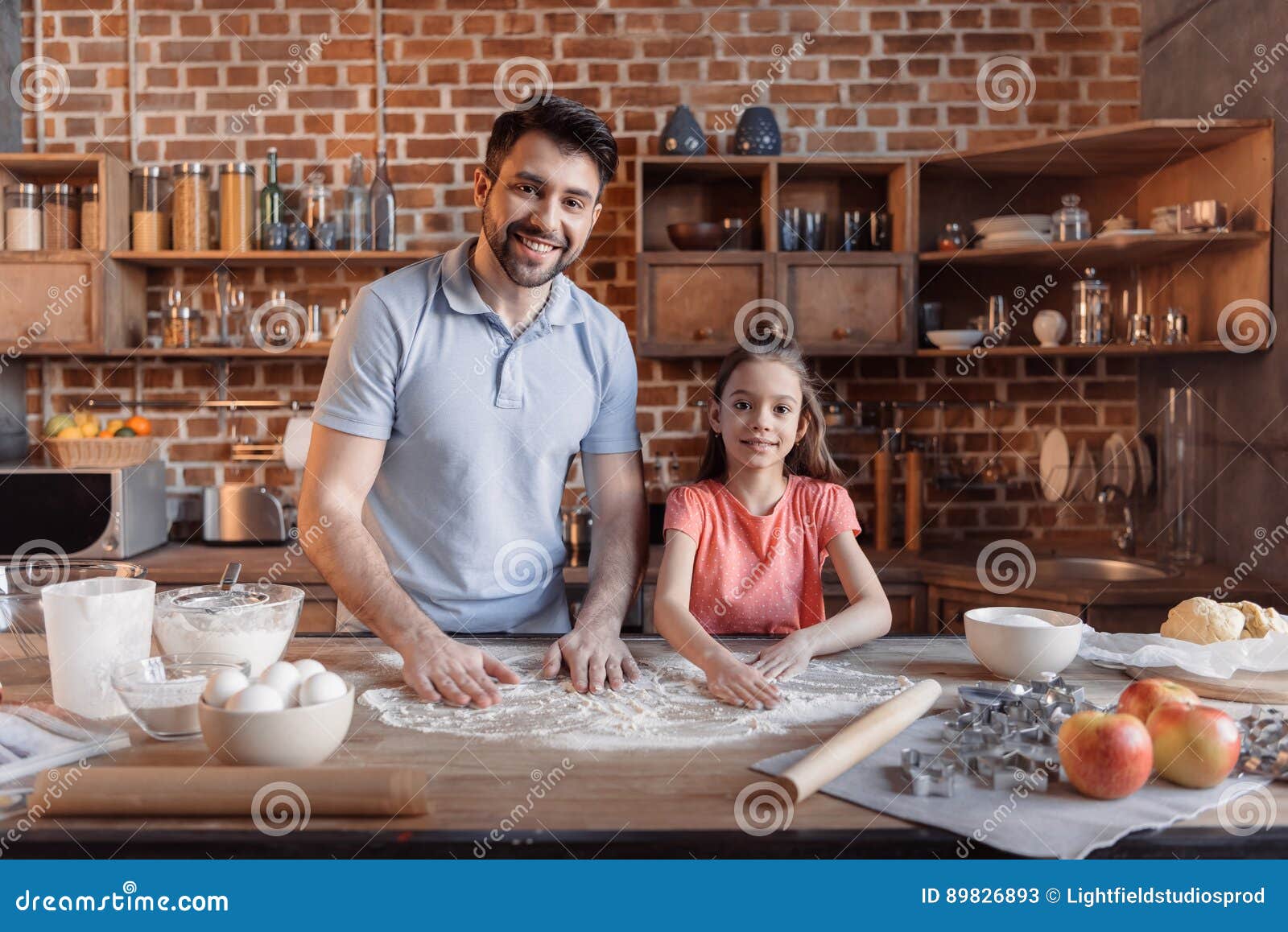 Father and Daughter Cooking Together and Smiling at Camera Stock Image ...