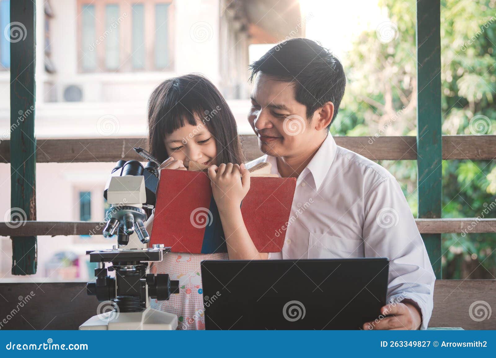 Father and Daughter Doing Learning Activities Outside the Classroom on ...