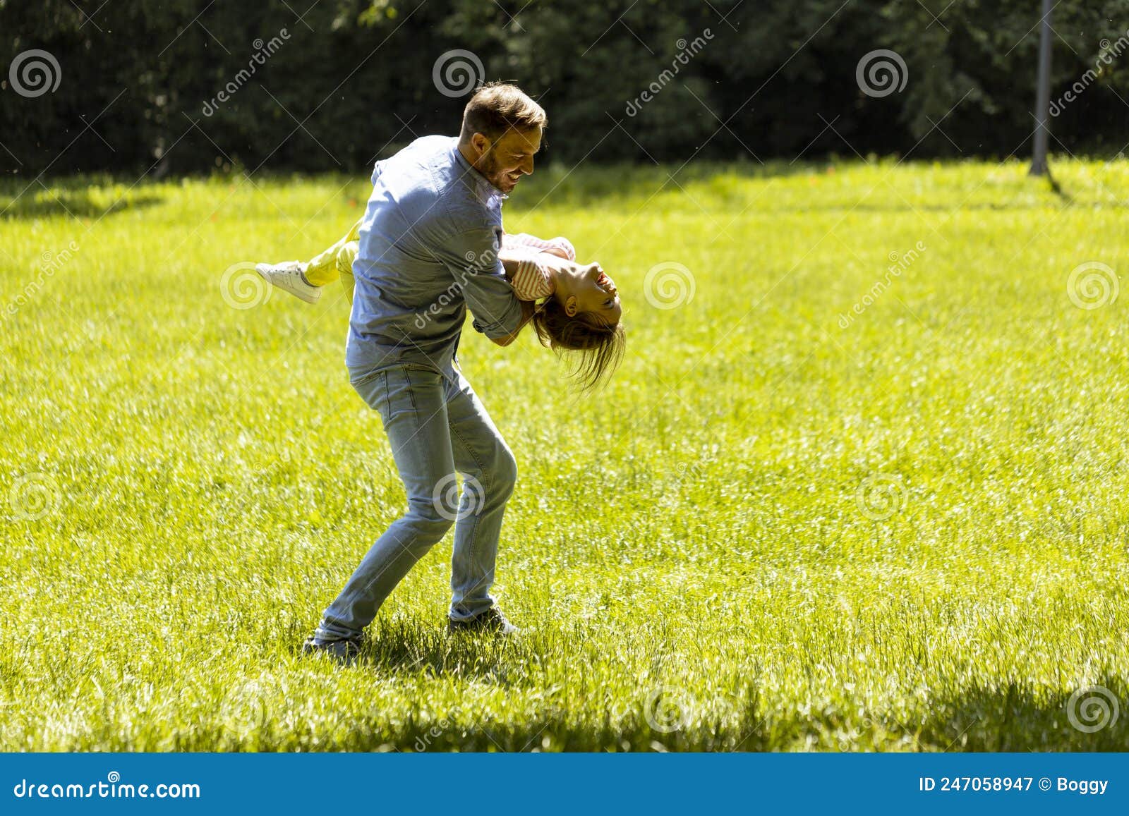 Father with Daughter Having Fun on the Grass at the Park Stock Image ...