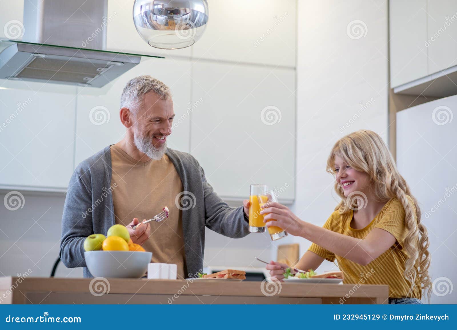 A Father and a Daughter in the Kitchen Having Breakfast Stock Image ...