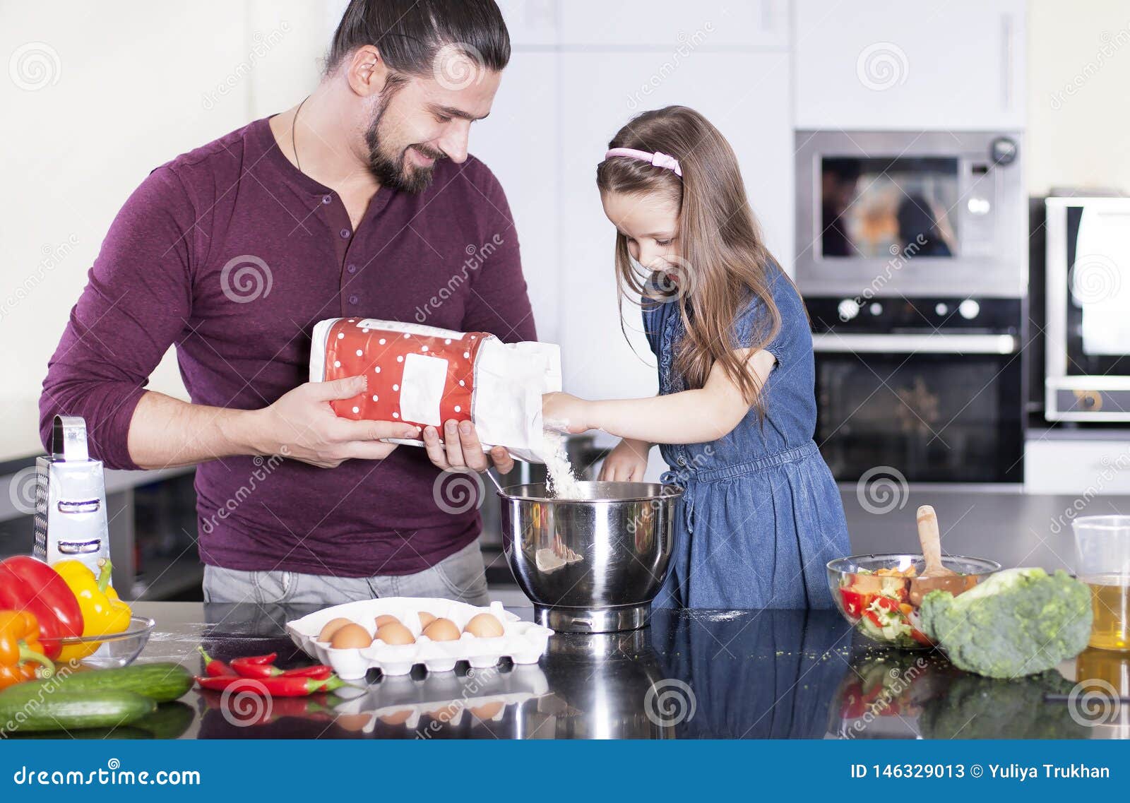 Father and Daughter Making Meal Together in Kitchen. Cooking Classes ...