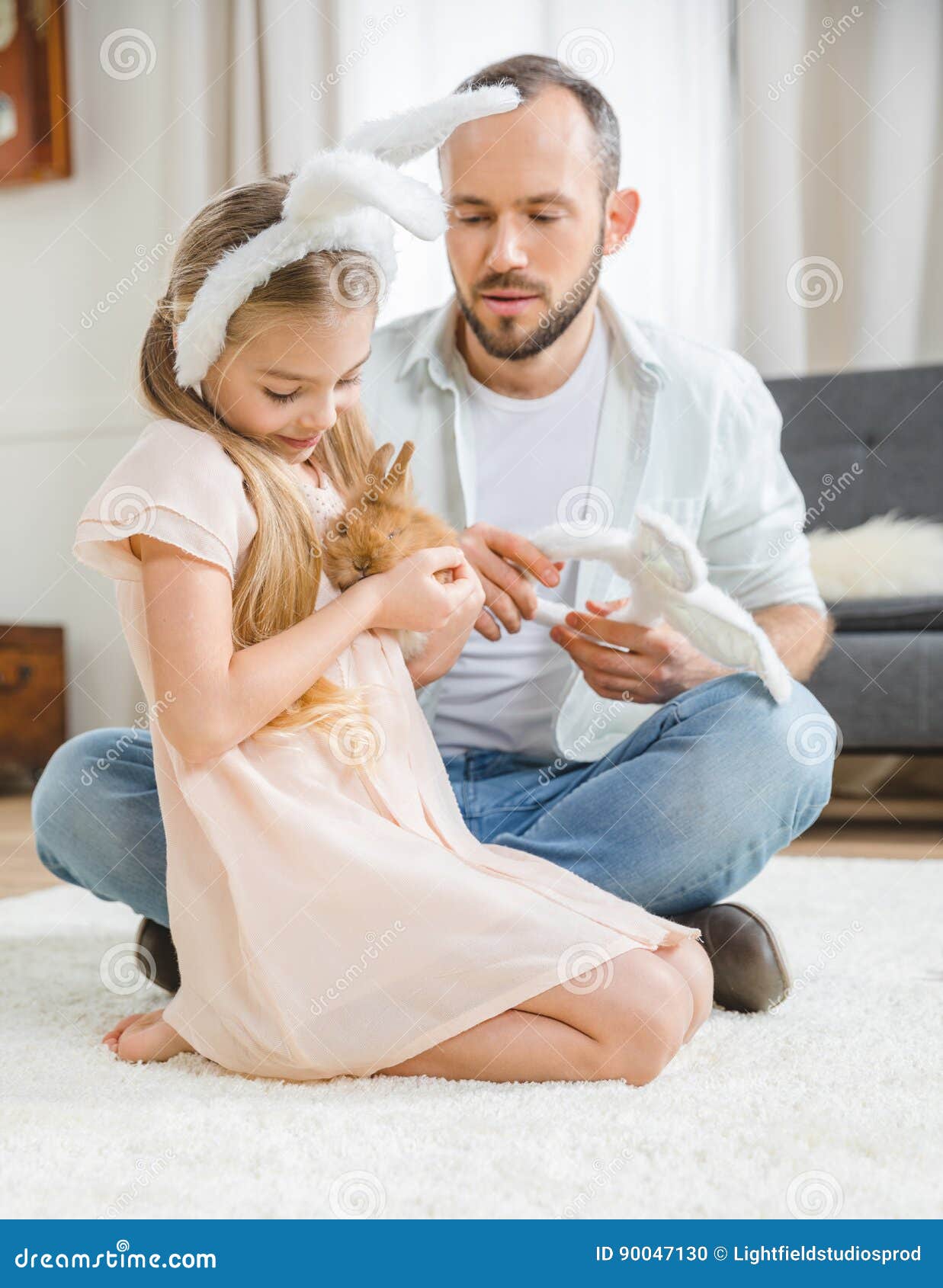 Father and Daughter Playing with Rabbit Stock Photo - Image of ...
