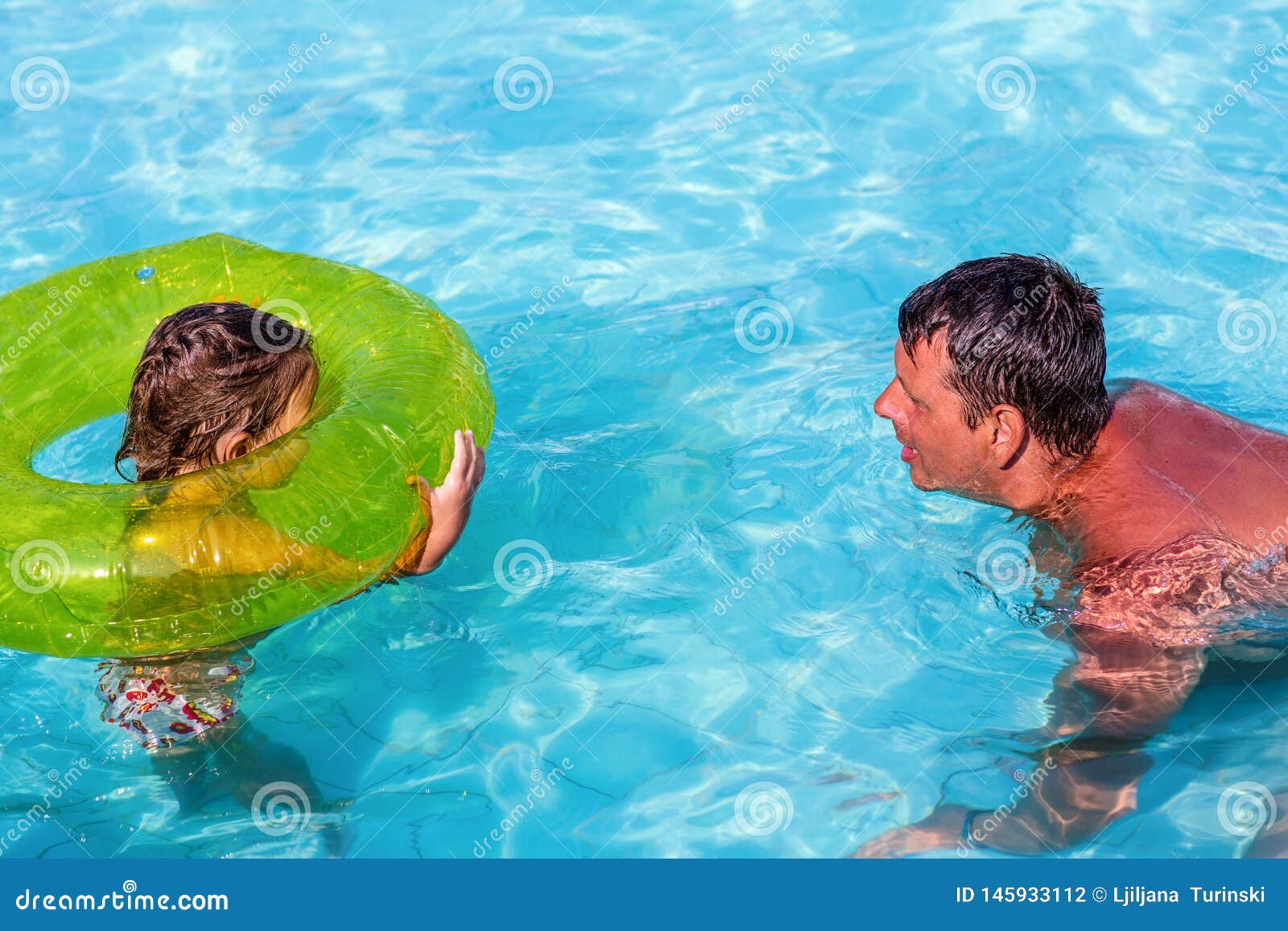 Father And Daughter Playing In Swimming Pool Summer Funny Vacation