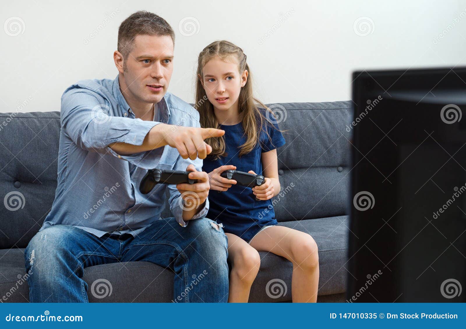 Father and Daughter Playing Video Game. Stock Image - Image of ...
