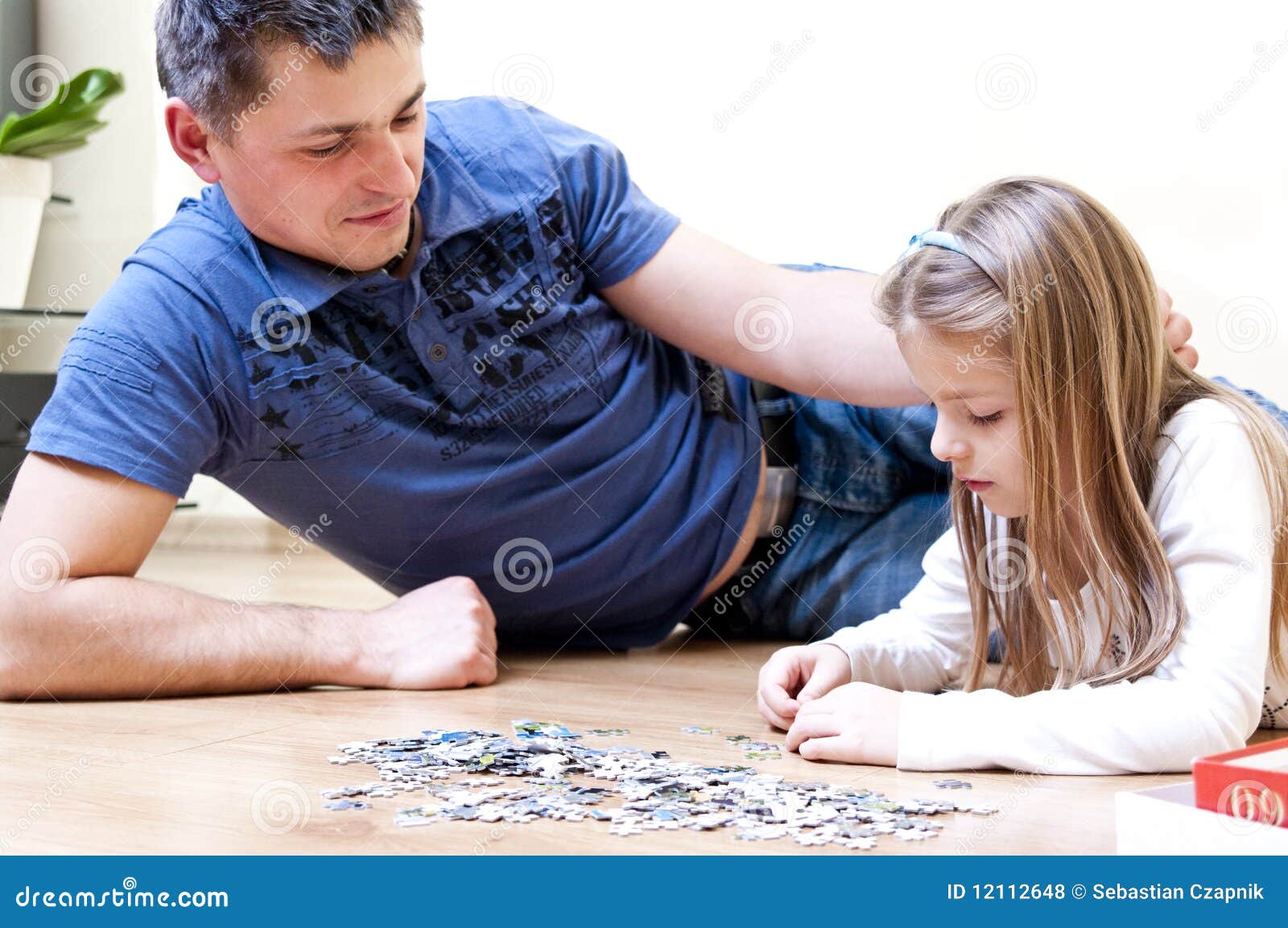 Father daughter puzzle stock photo. Image of proudly - 12112648