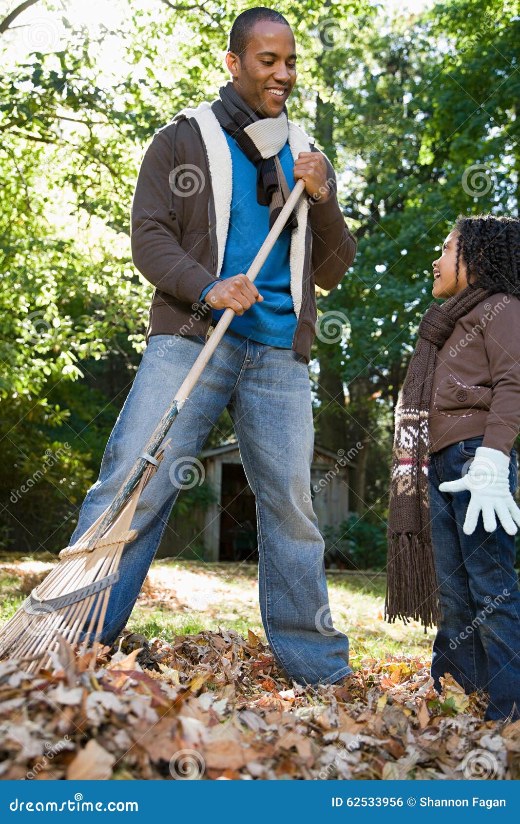 People Raking Leaves Vertical Stock Photos - Free & Royalty-Free Stock ...