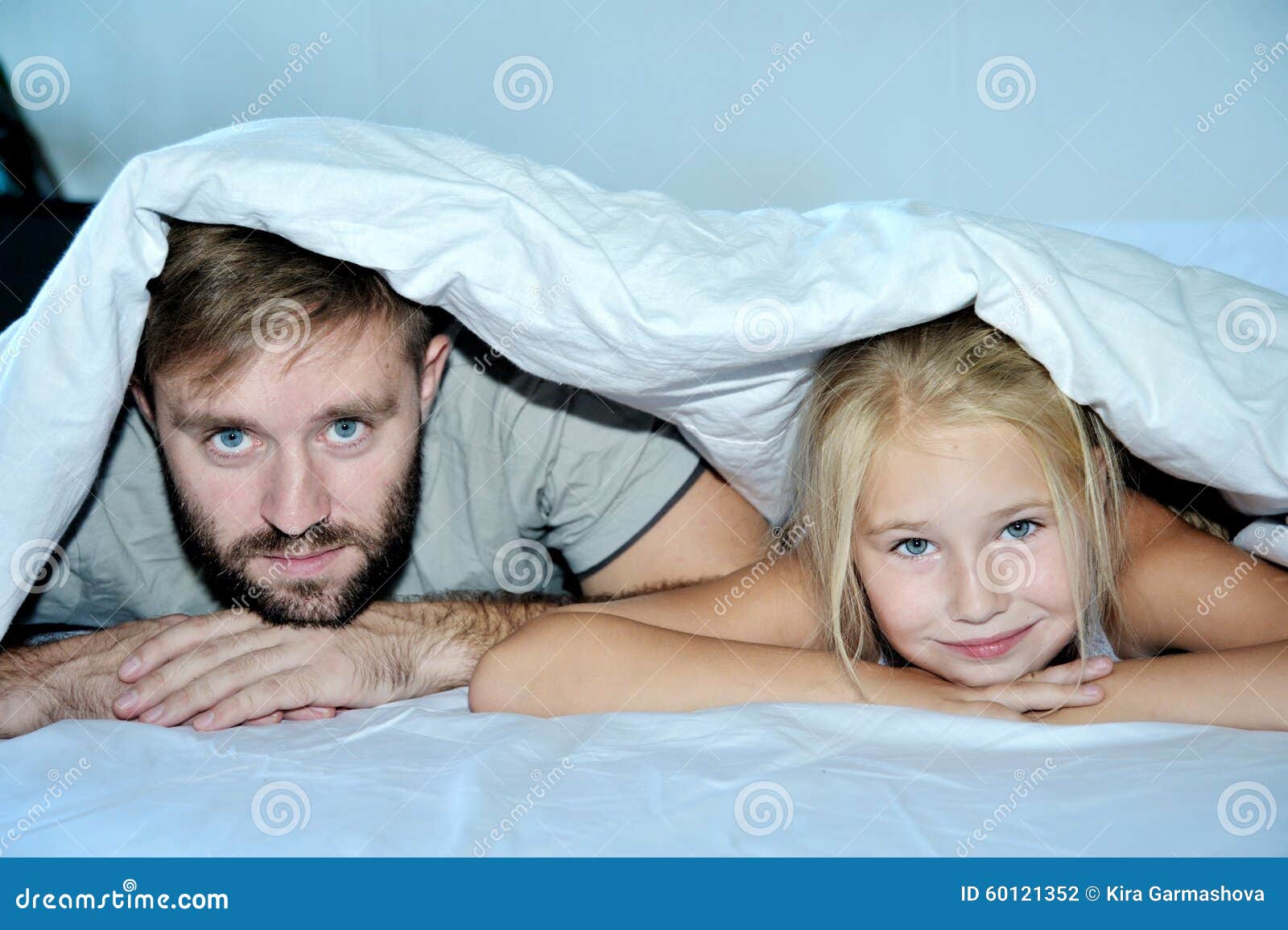 Father and Daughter Relaxing Together in Bed Stock Photo - Image of ...