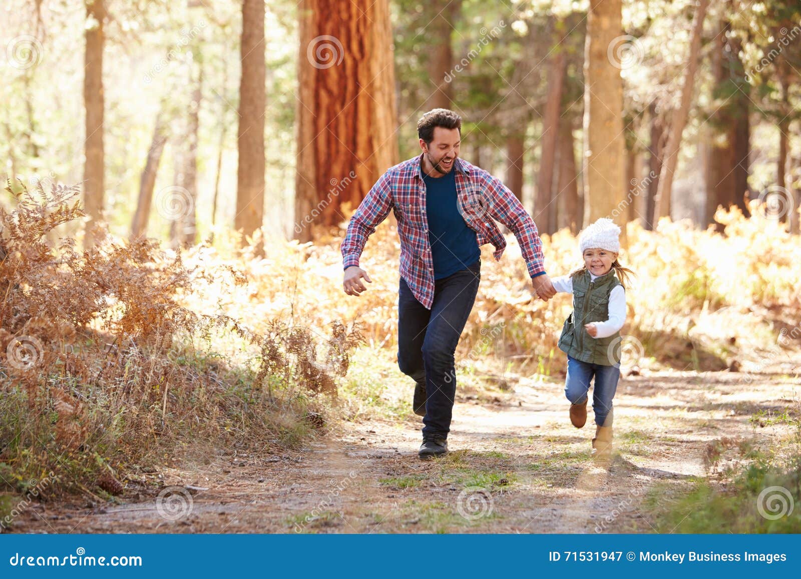 Father and Daughter Running through Fall Woodland Stock Image - Image ...