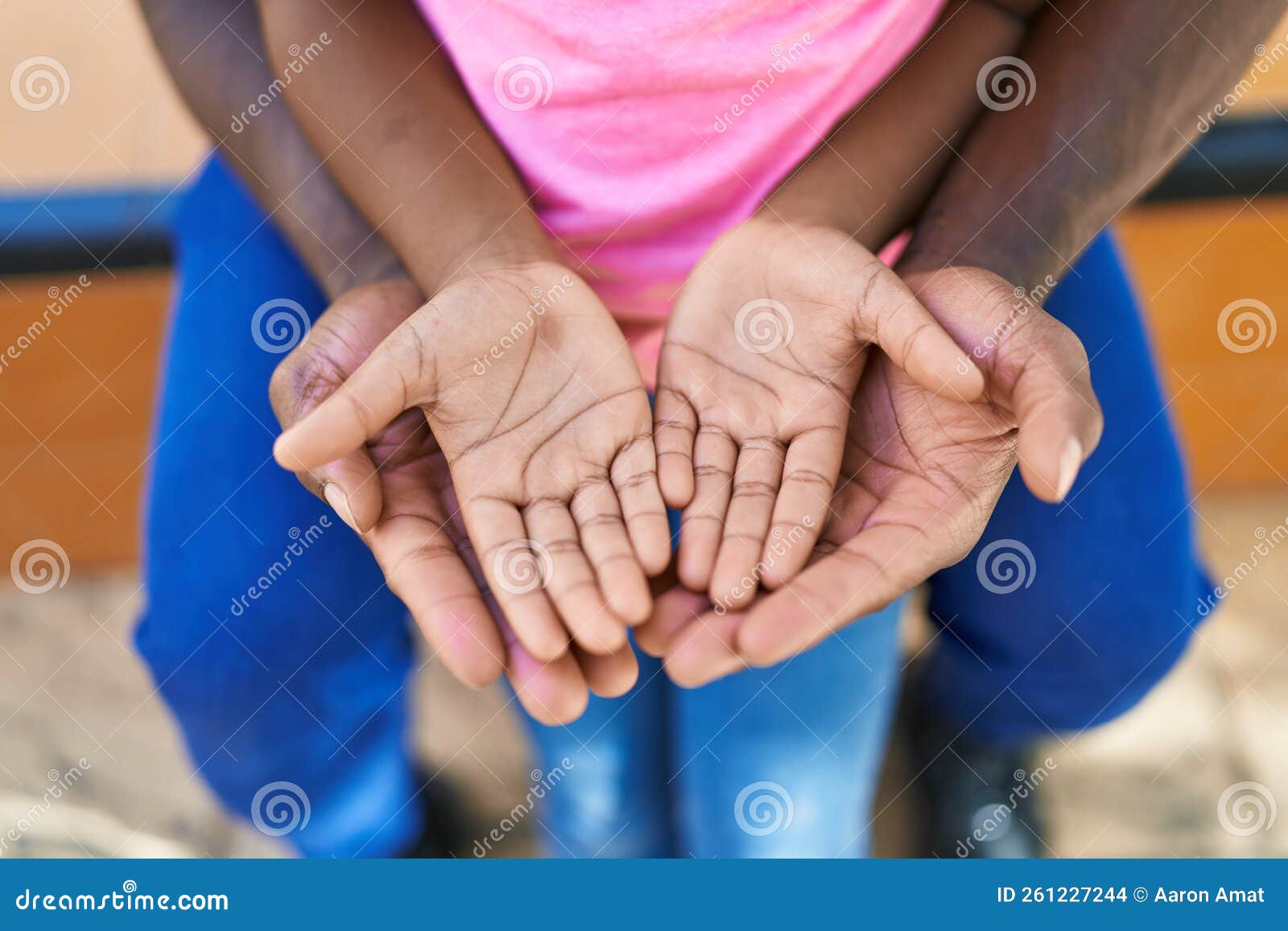 Father and Daughter Sitting on Bench with Hands Together at Park Stock ...