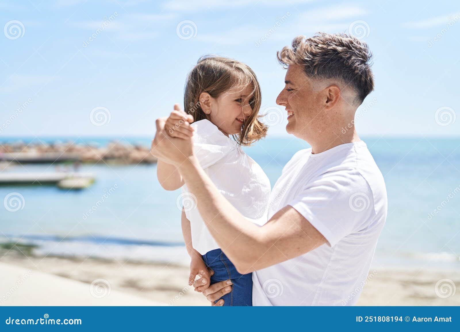 Father and Daughter Smiling Confident Dancing at Seaside Stock Photo ...