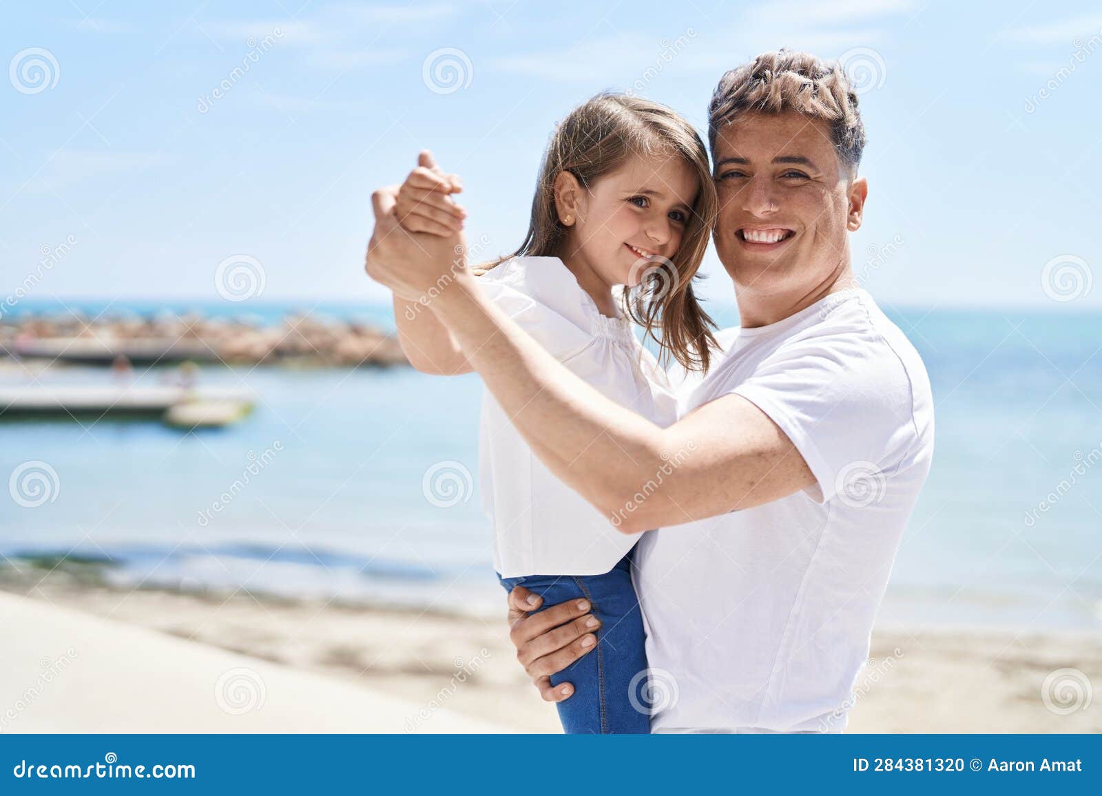 Father and Daughter Smiling Confident Dancing at Seaside Stock Photo ...