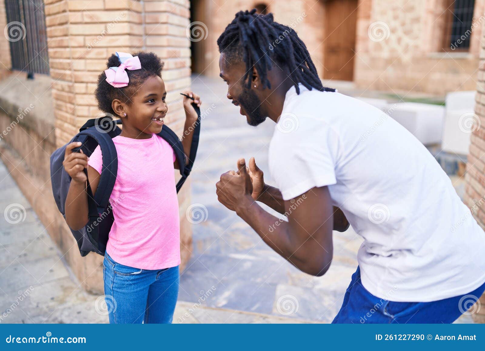 Father and Daughter Standing Together Speaking at School Stock Photo ...