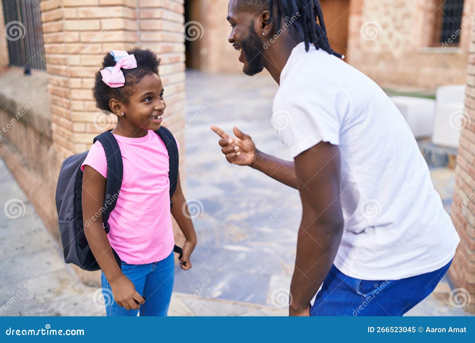 Father and Daughter Standing Together Speaking at School Stock Image ...