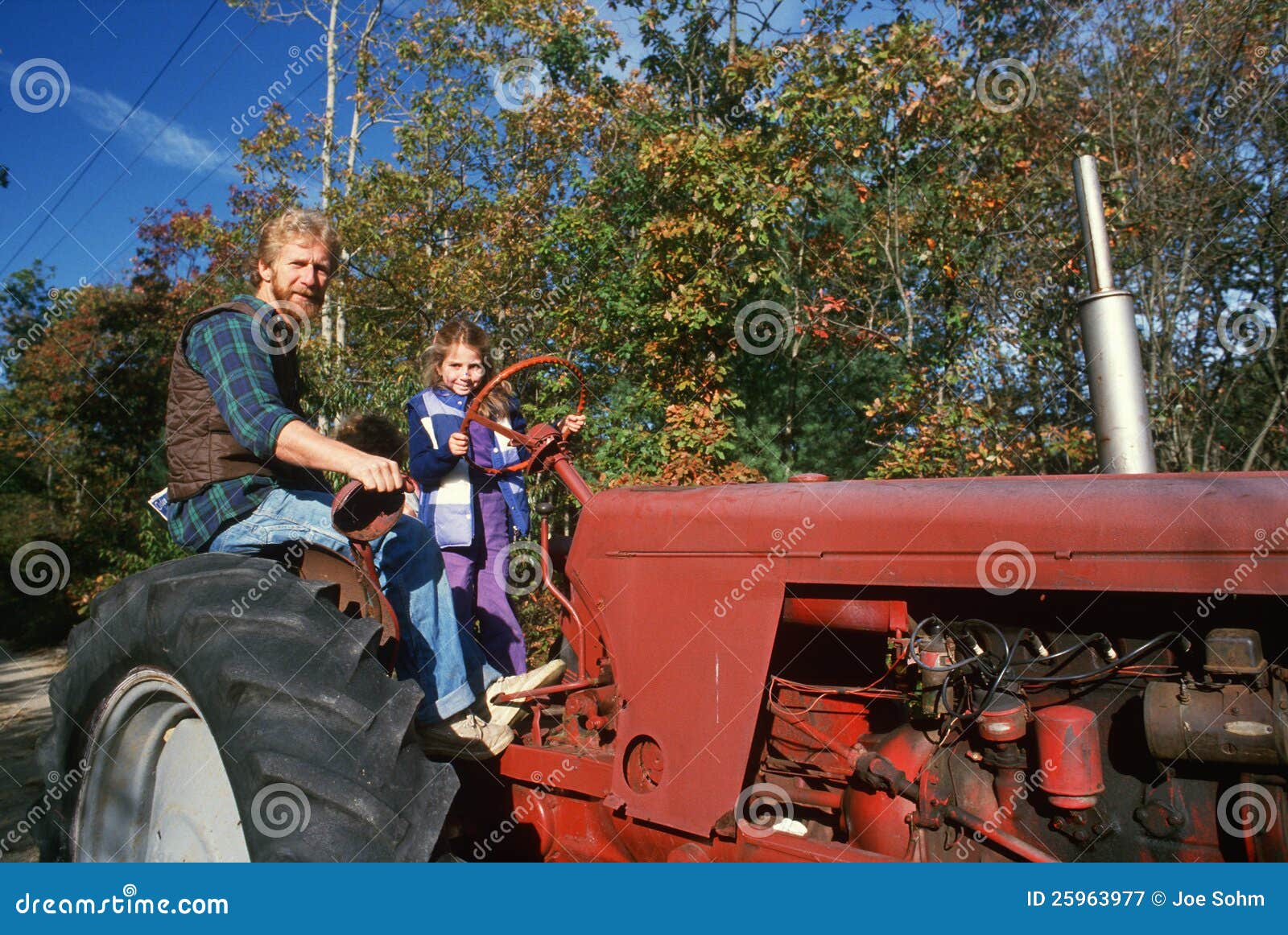 A Father and Daughter on a Tractor, Editorial Photography - Image of ...
