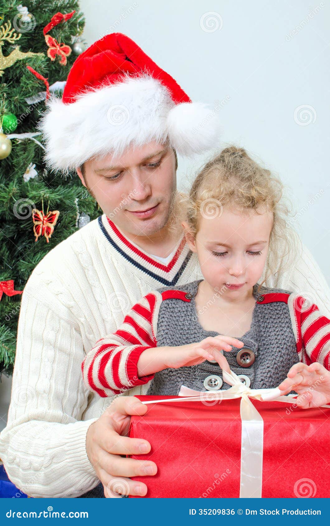 Father and Daughter Unpacking Gift Stock Photo - Image of portrait ...