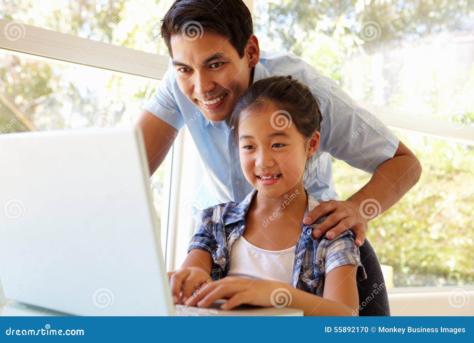 Father and Daughter Using Laptop Stock Photo - Image of help, computer ...