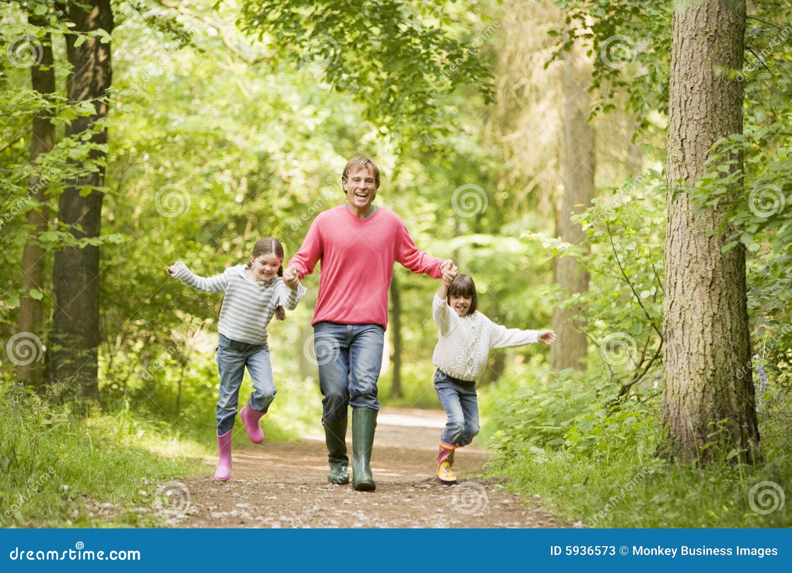 Father and Daughters Walking on Path Holding Hands Stock Image - Image ...