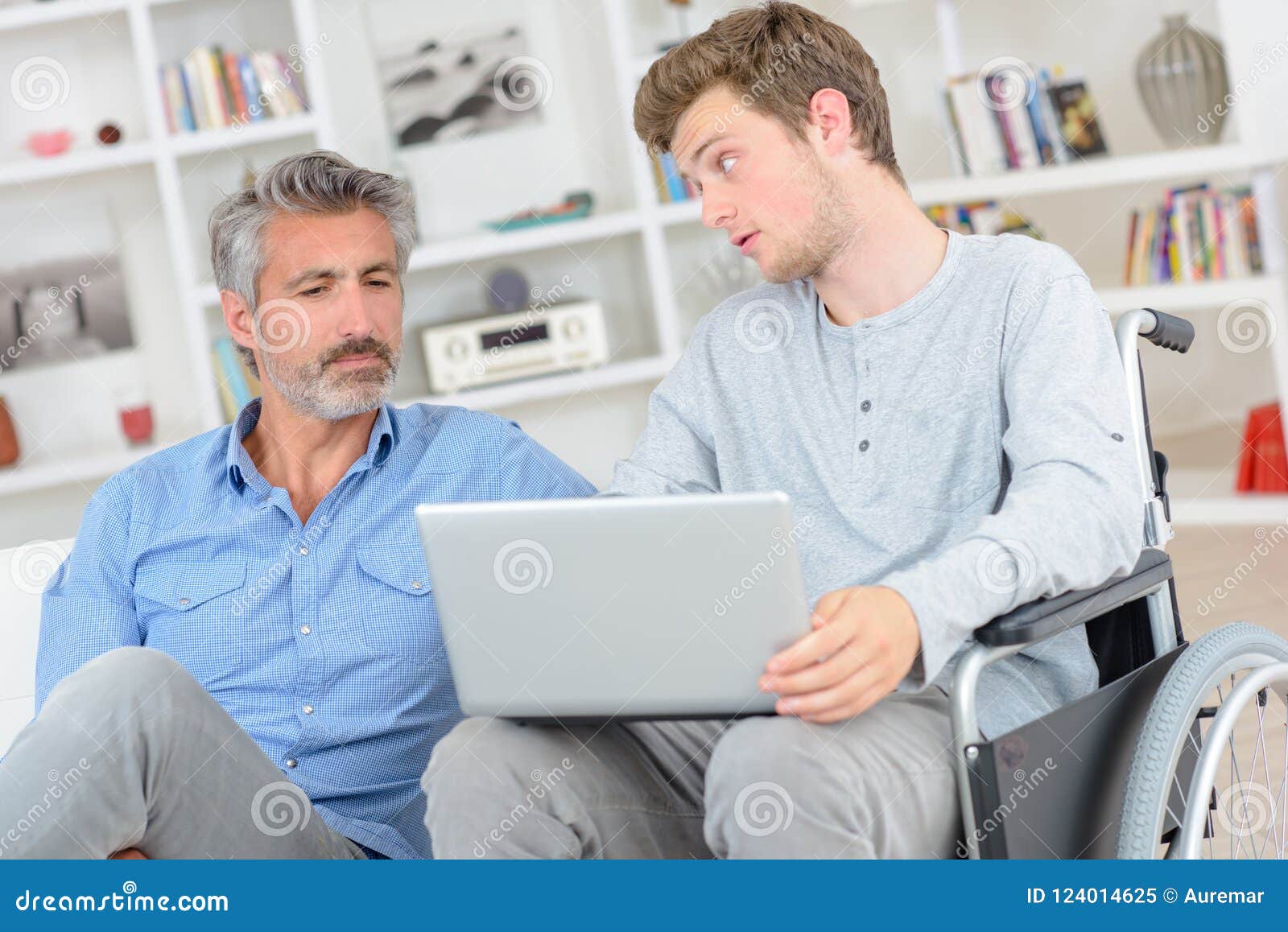 Father and disabled son stock image. Image of male, gadget - 124014625