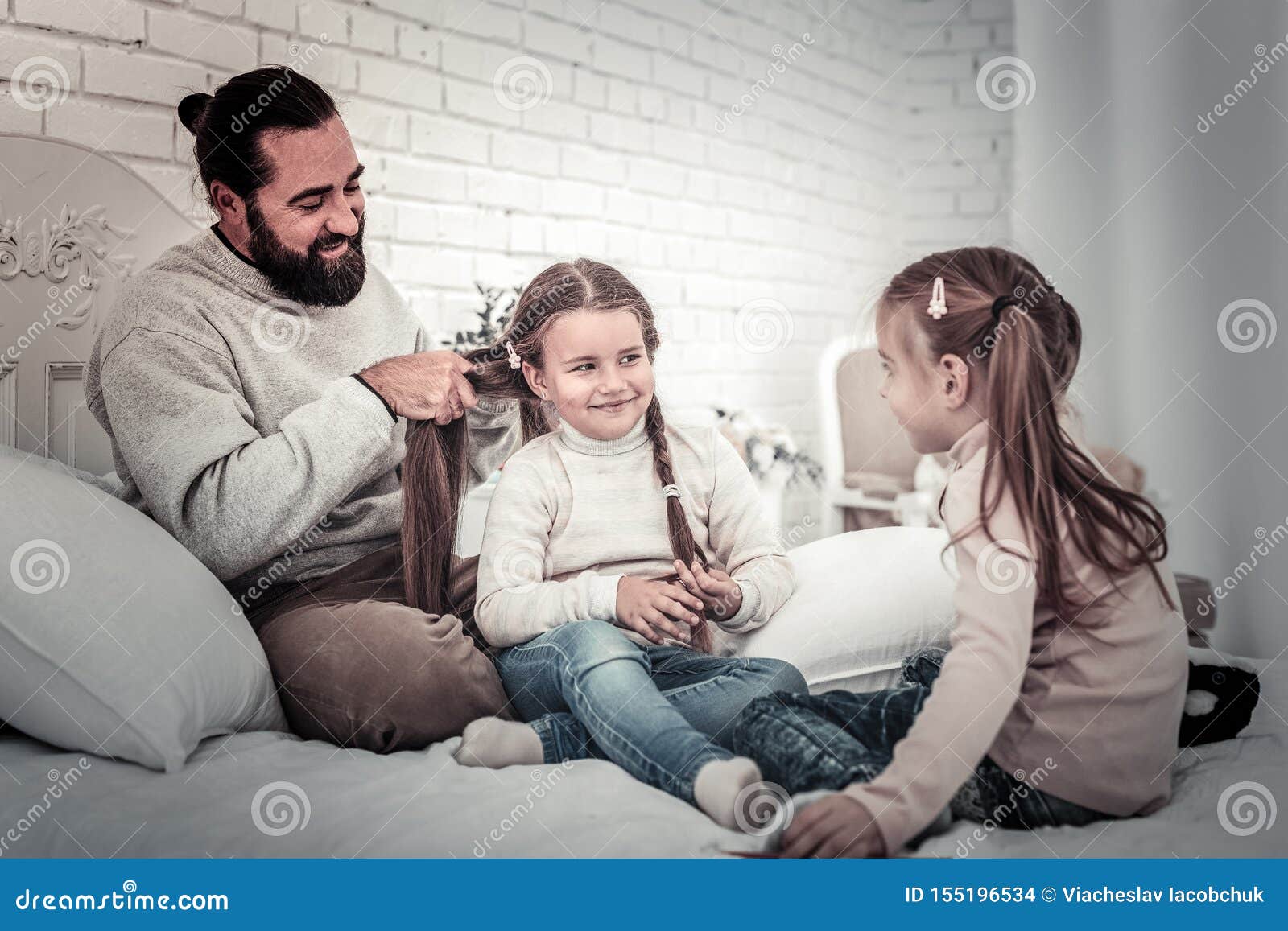 Father Doing His Kids Braids Sitting on Bed Stock Photo - Image of ...