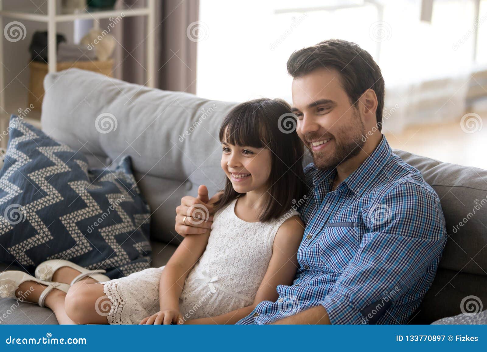Father Embrace Daughter Sitting Together On Couch Stock Image Image