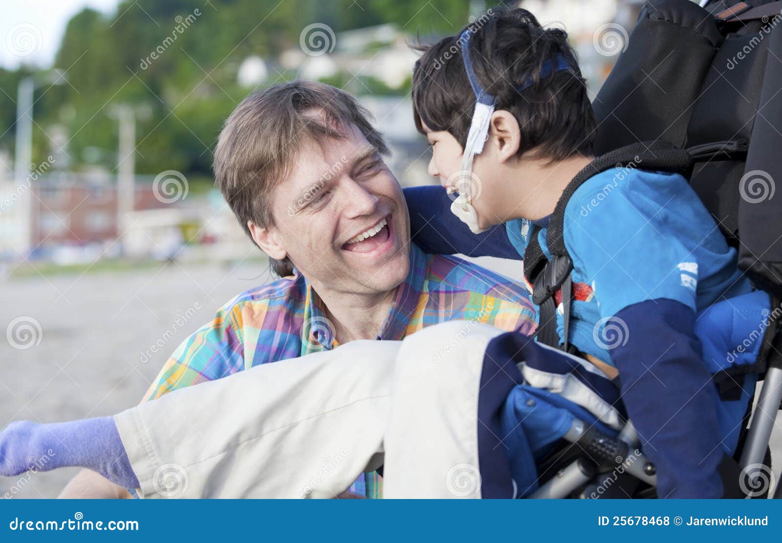 Father Enjoying Beach with Disabled Son Stock Photo - Image of care ...