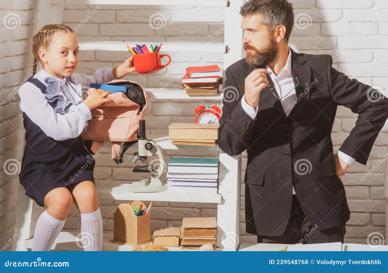 Father Explaining Homework To His Daughter at Home. Doing Homework with ...