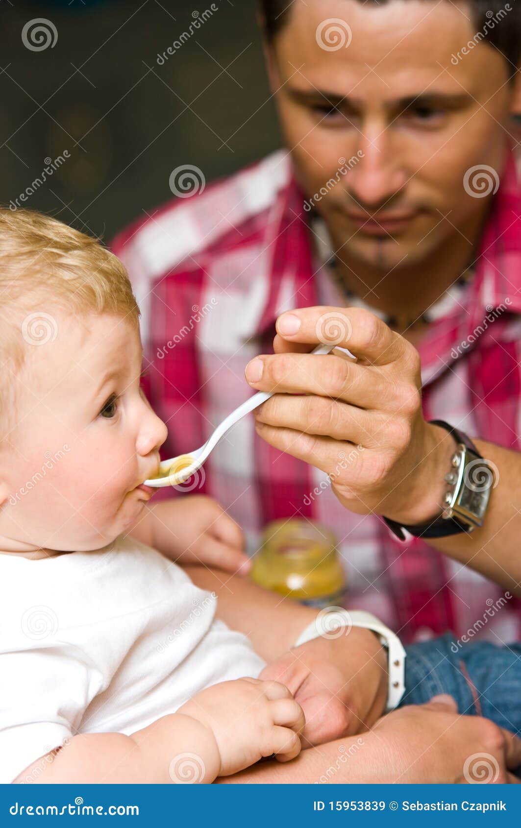 Father feeding baby stock image. Image of adult, parenthood - 15953839