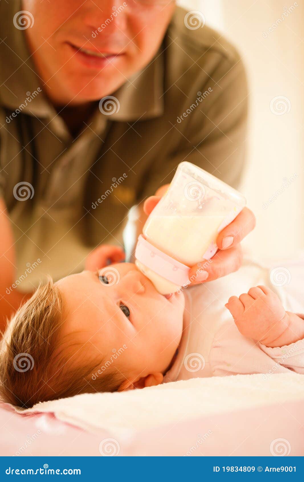 Father is feeding the baby stock image. Image of people - 19834809