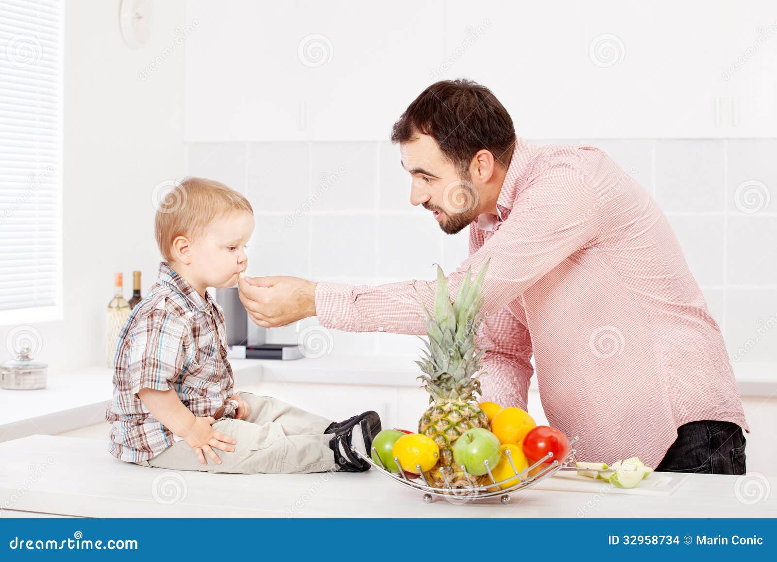 Father Feeding Child in Kitchen Stock Photo - Image of fruit, child ...