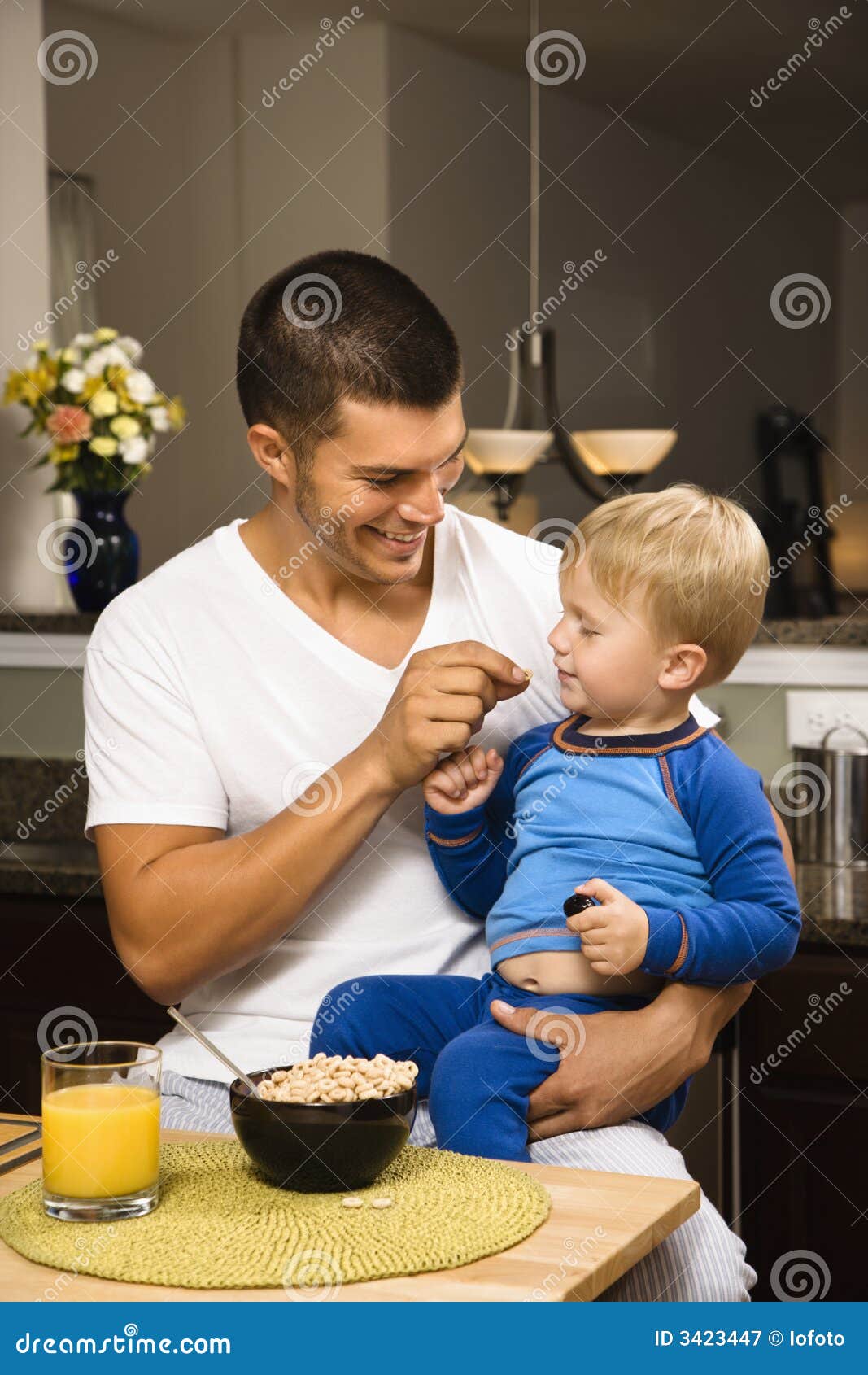 Father feeding son. stock image. Image of parent, relationship - 3423447