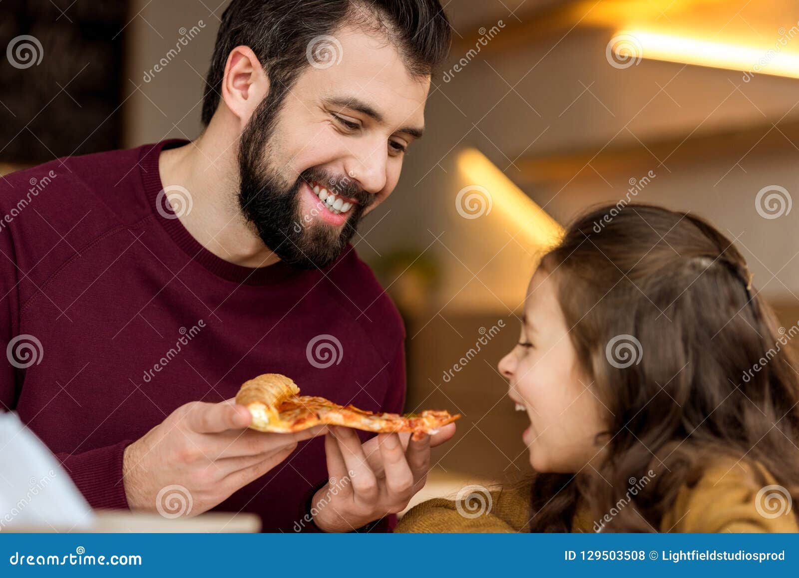 Father Giving Daughter To Bite a Piece Stock Photo - Image of daughter ...