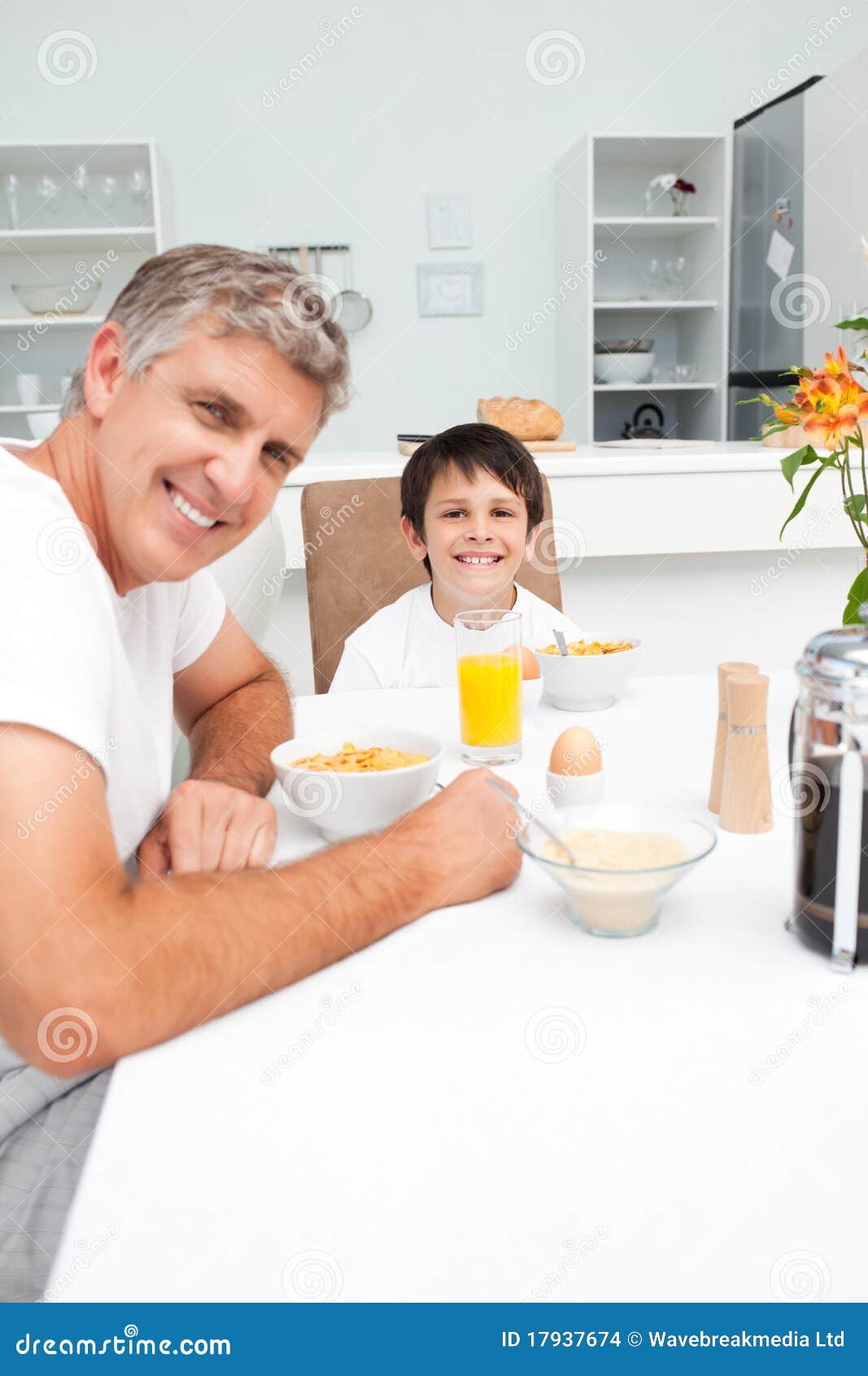 Father Having His Breakfast with His Son Stock Photo - Image of child ...