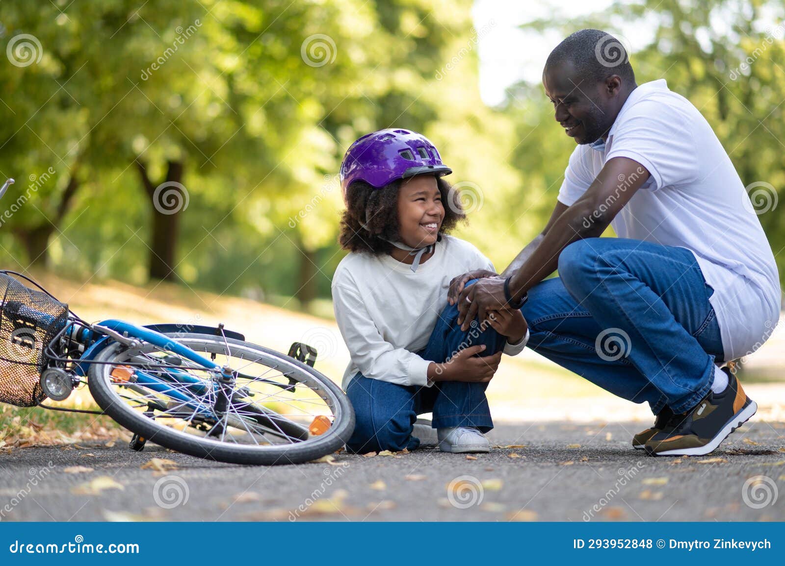 Father Helping His Kid after Falling from the Bike Stock Photo - Image ...