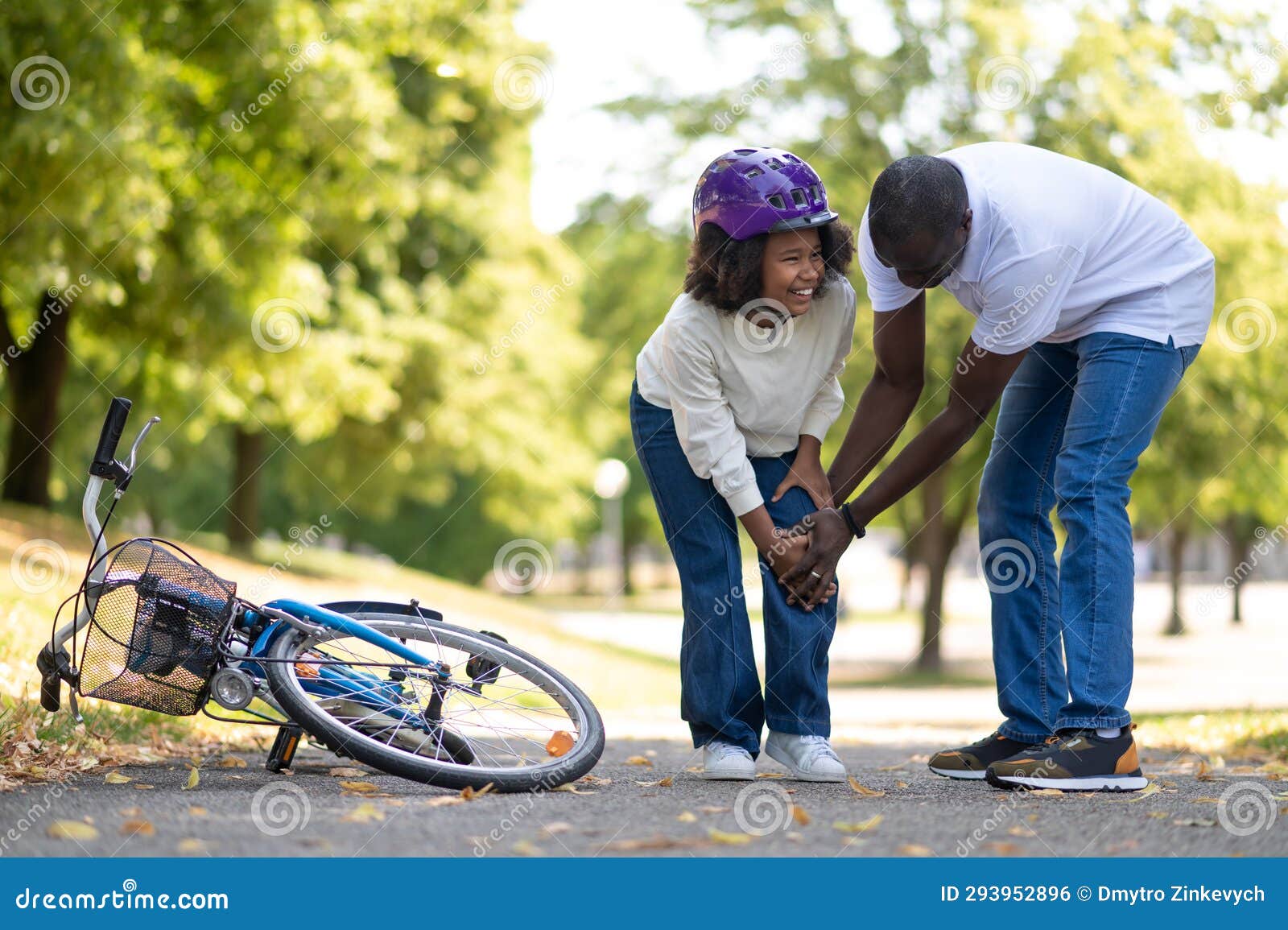 Father Helping His Kid after Falling from the Bike Stock Photo - Image ...