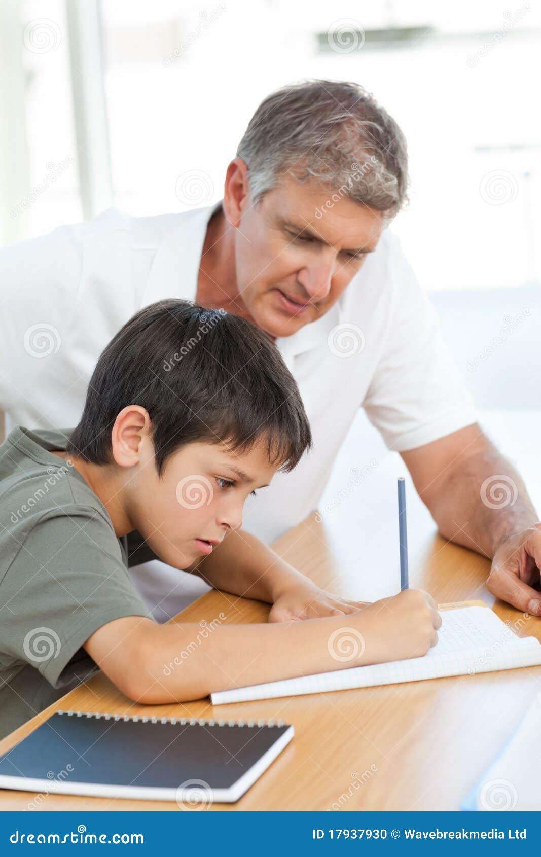 Father Helping His Son with His Homework Stock Photo - Image of people ...