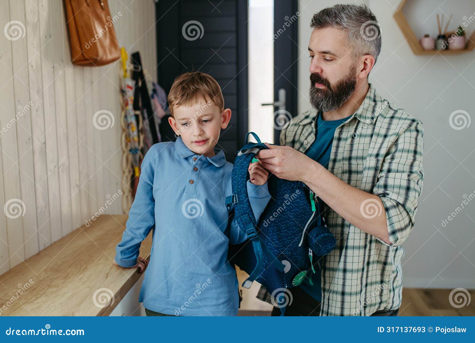 Father Helping Son Get Ready for Kindergarten, Preschool. Putting ...