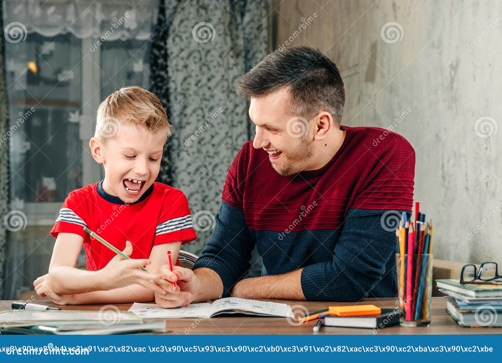 The Father Helps His Son To Do Homework for the School. Stock Image ...