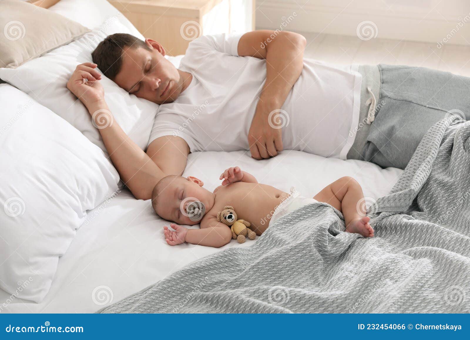 Father with His Cute Baby Sleeping in Bed at Home Stock Photo - Image ...