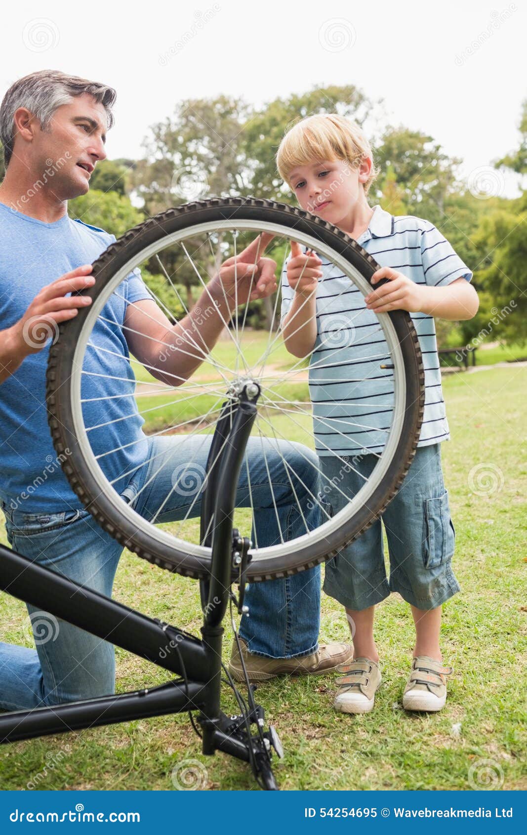 Father and His Son Fixing a Bike Stock Image - Image of mature, spring ...