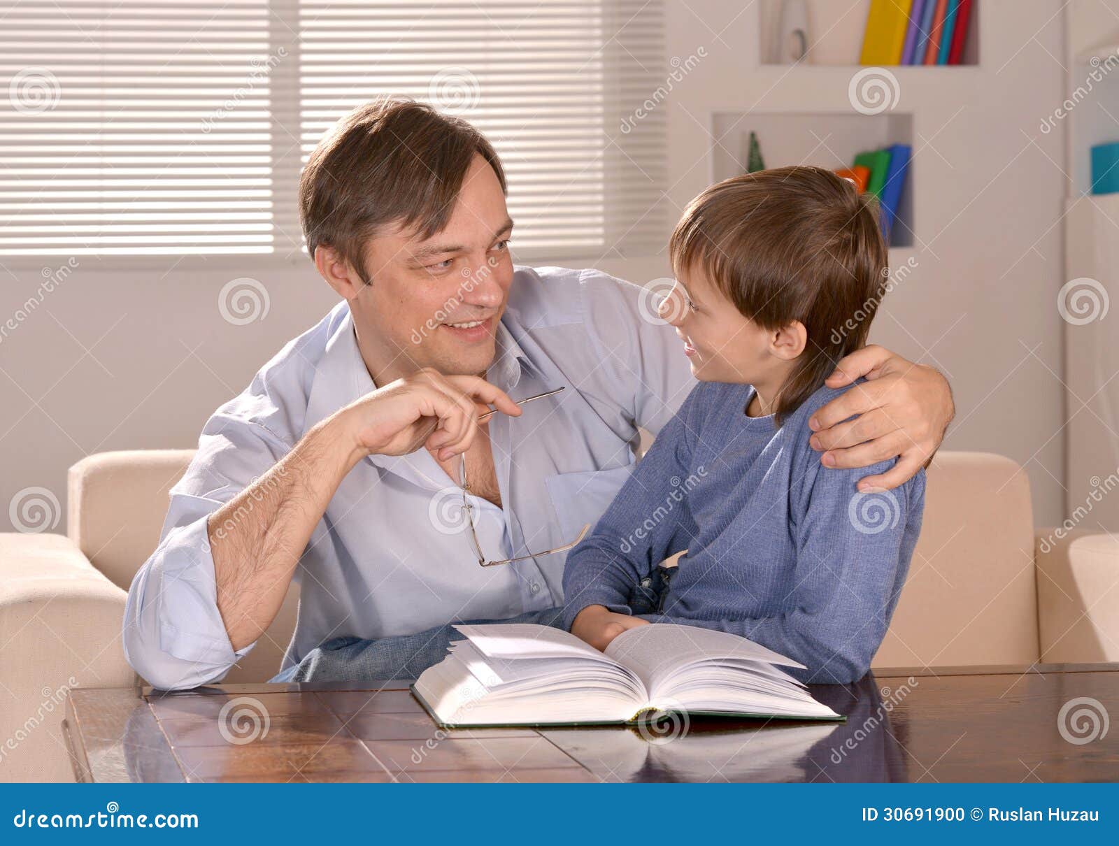 Father and his son sitting stock photo. Image of parent - 30691900