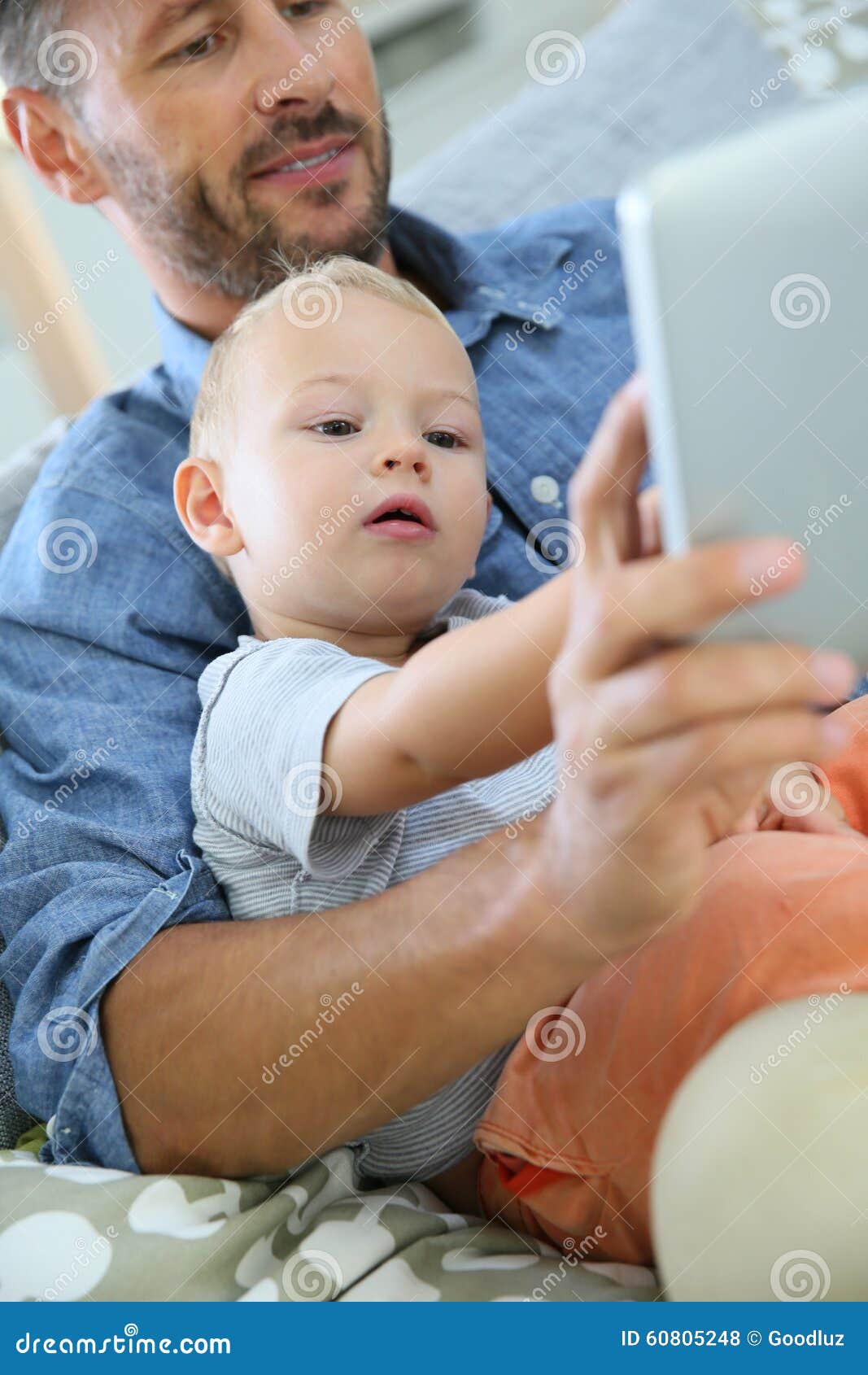 Father and His Son Using Tablet Together Stock Photo - Image of father ...