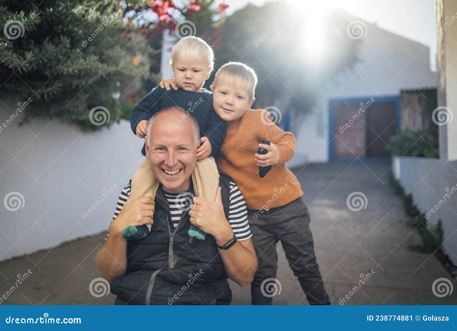 Father with His Two Sons Hugging Each Other Outdoor Stock Image - Image ...