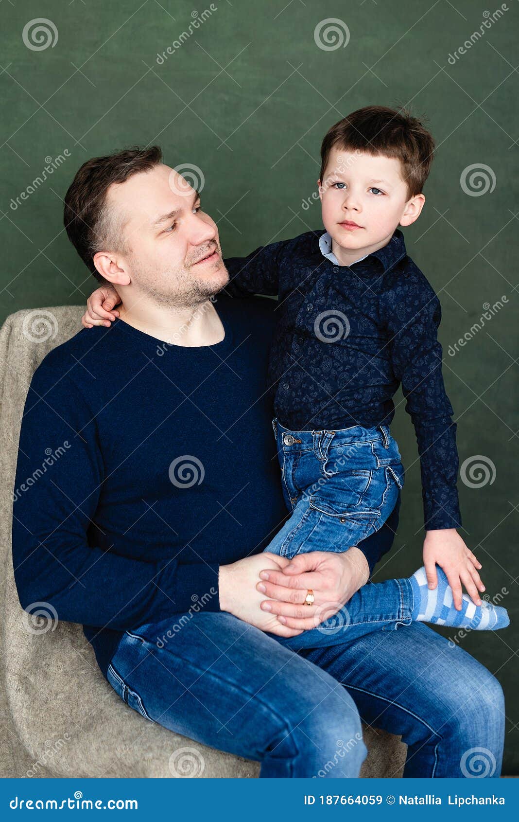 Father Holds His Son in His Lap Stock Image - Image of energetic ...