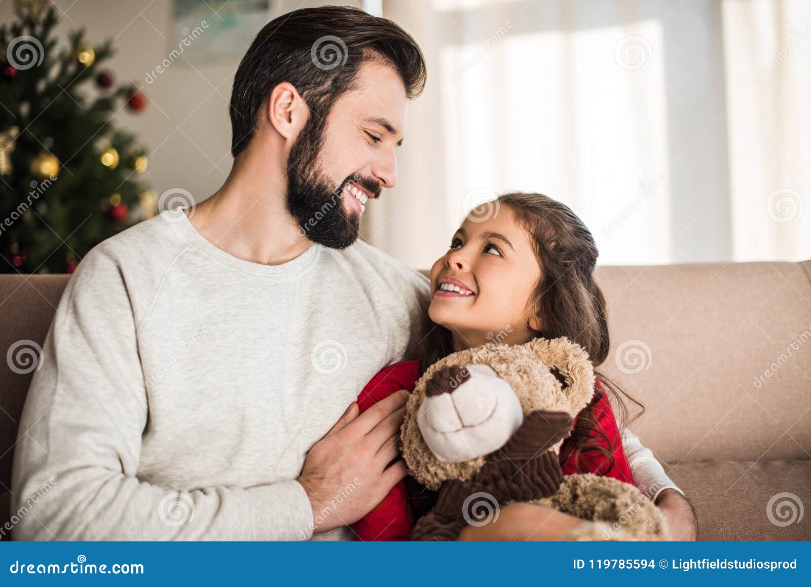 Father hugging daughter stock photo. Image of indoors - 119785594