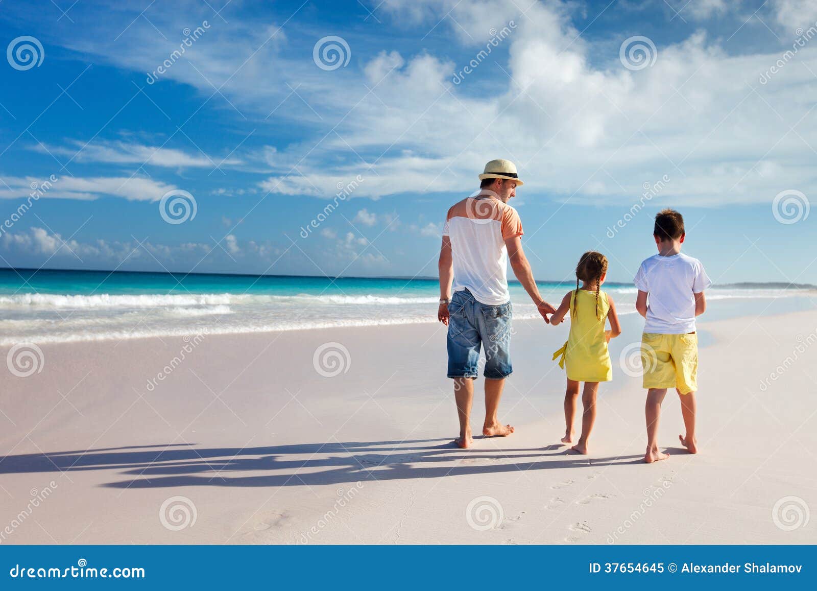 Father with kids at beach stock image. Image of sibling - 37654645