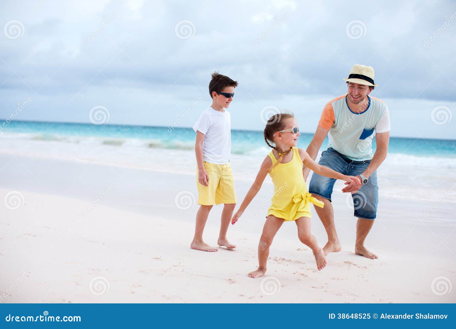 Father with kids at beach stock image. Image of coast - 38648525