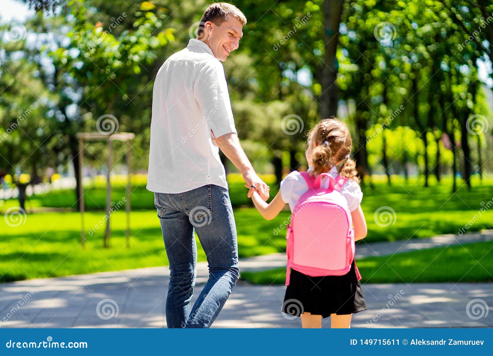Father Leads Daughter To School in First Grade. First Day at School ...