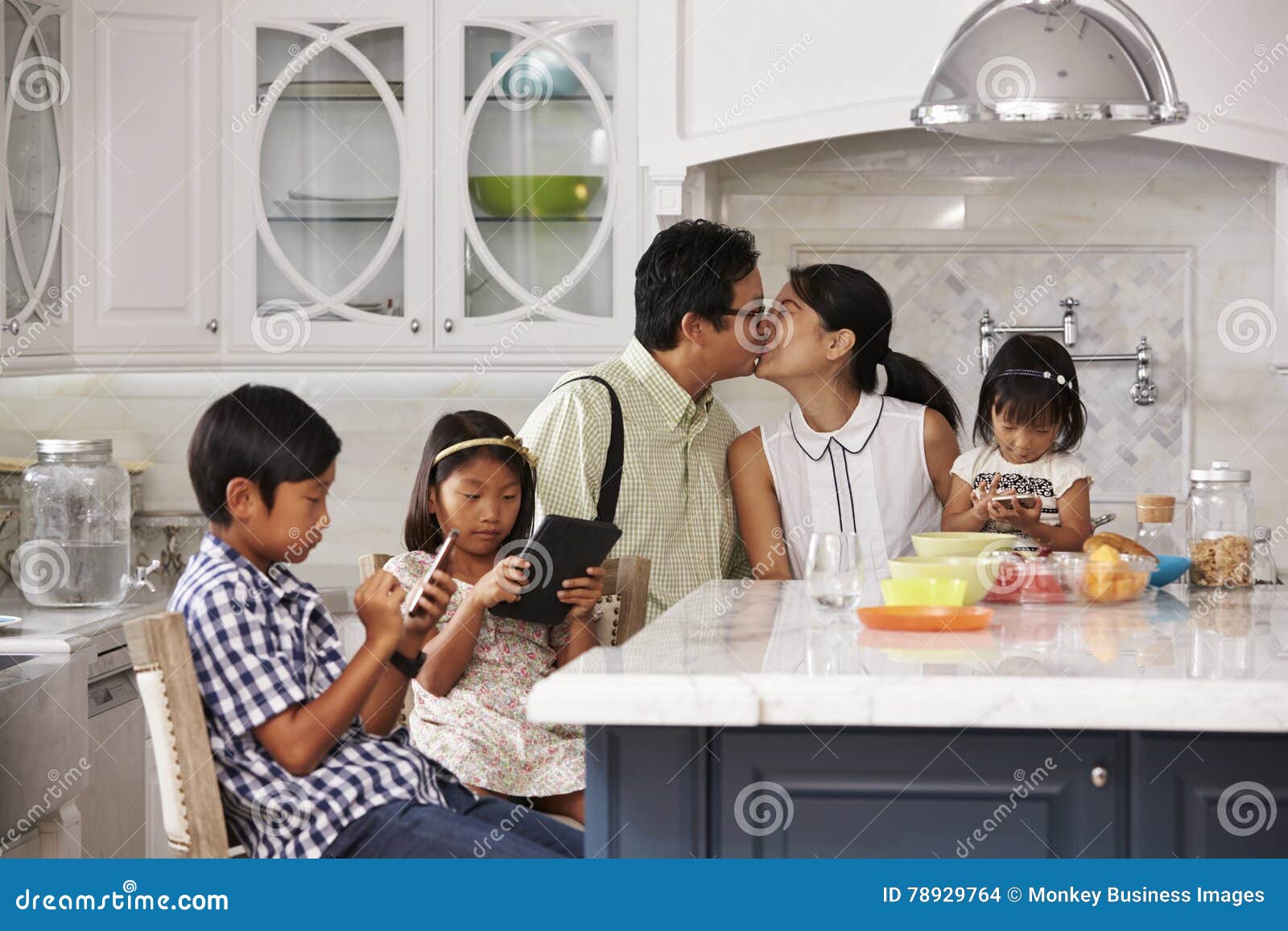 Father Leaving for Work after Family Breakfast in Kitchen Stock Photo ...