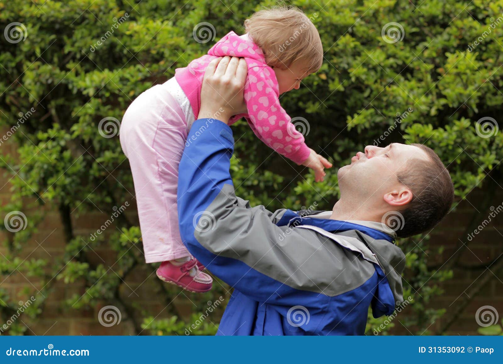 Father lifting daughter up stock photo. Image of adorable - 31353092